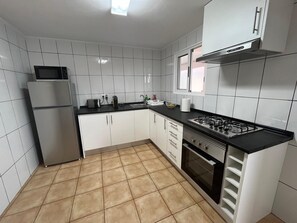 Casa | Cozinha privada | Geladeira, micro-ondas, fogão, cooktop