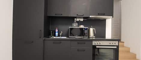 Apartamento, 1 quarto | Cozinha privada | Uma máquina de café expresso, uma cafeteira/bule, uma chaleira elétrica