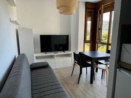 Apartamento | Área de estar | TV 49 polegadas com canais digitais