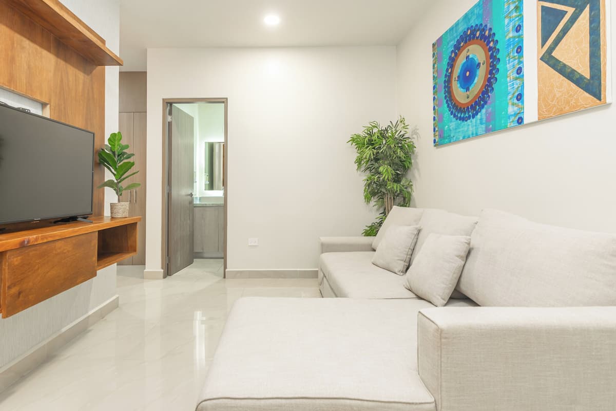 Apartamento superior | Área de estar | TV LED