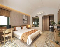 Quarto de hotel moderno com cama, escrivaninha e guarda-roupa.