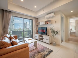 Apartamento Deluxe, 2 quartos, Vista para a cidade | Sala de estar