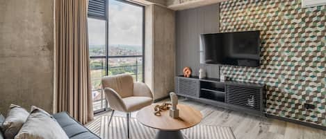 Apartamento Comfort | Sala de estar | Televisor de 30 polegadas com canais por cabo