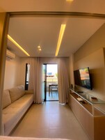 Estúdio luxo, 1 cama de casal e sofá-cama | Área de estar | TV