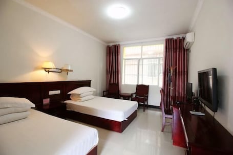Quarto. Jinghong HuaJing Hotel