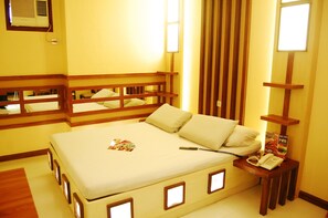 Quarto executivo, 1 cama Queen | Wi-Fi de cortesia, roupa de cama