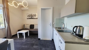 Apartamento standard, 1 quarto | Área de estar | TV LCD