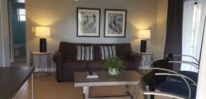 Apartamento, 1 quarto, cozinha | Área de estar | TV de tela plana