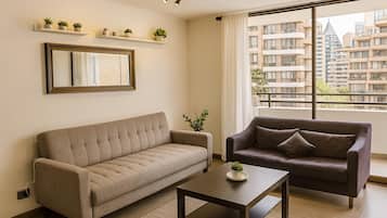 Apartamento Deluxe | Sala de estar | TV de ecrã plano