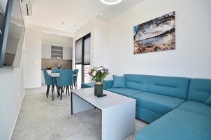 Apartamento Panorâmico | Sala de estar | Televisor 