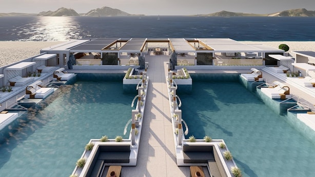 Uma área de piscina moderna com duas seções simétricas, um caminho central e vista para o mar.
