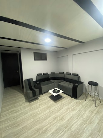 Quarto famĆlia, vista para o parque | Ćrea de estar | TV