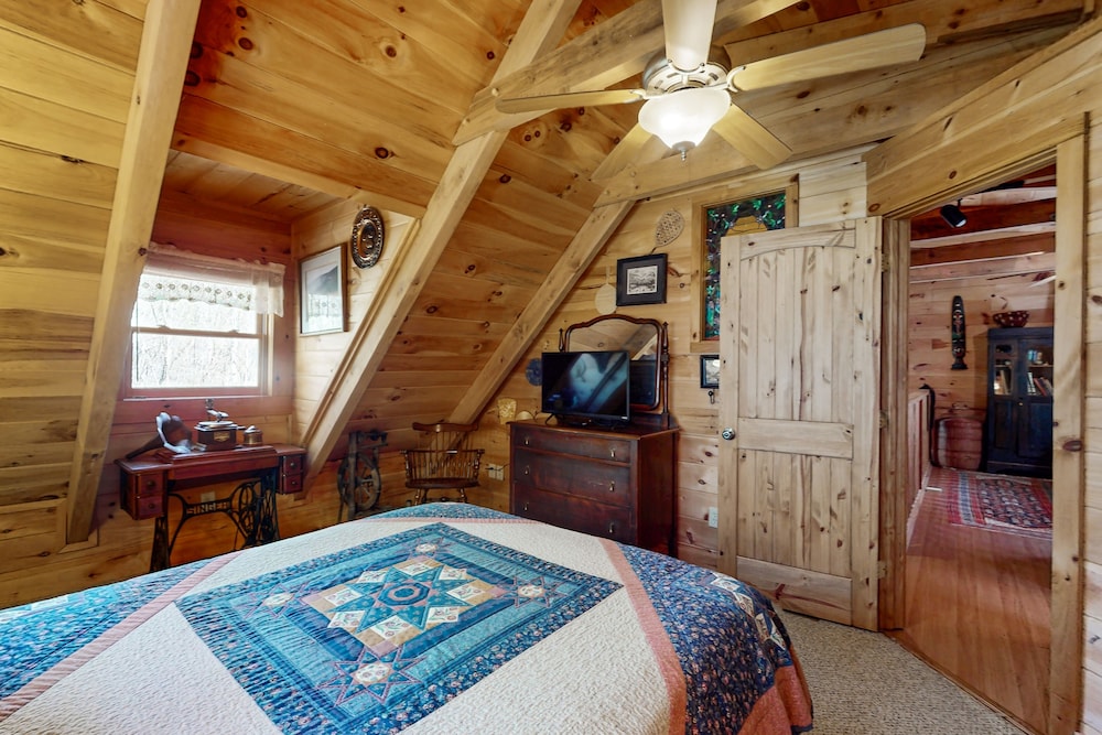 Cabin nestled in a secluded wooded area with mountain views and ...