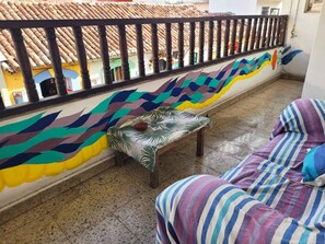 Quarto Triplo Deluxe, varanda | Varanda