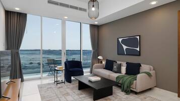 Apartamento Deluxe, 1 cama king-size e sofá-cama, varanda | Sala de estar