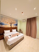 Quarto Duplo Deluxe | Roupa hipoalergénica, camas de colchão viscoelástico, minibar 