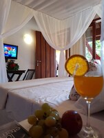 Suíte econômica, 1 cama Queen, para não fumantes, ar-condicionado | Wi-Fi de cortesia, roupa de cama