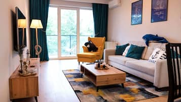 Apartamento conforto, 2 quartos | Sala de estar