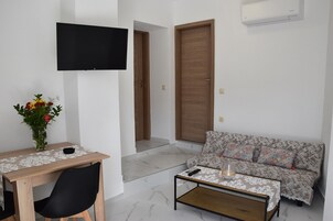 Apartamento Deluxe, vista para a montanha | Sala de estar