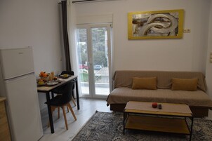 Apartamento Deluxe, vista para a montanha | Sala de estar