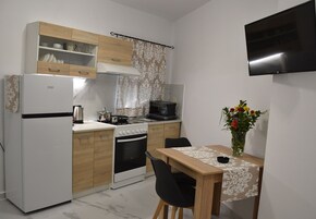 Apartamento Deluxe, vista para a montanha | Cozinha privada | Um frigorífico/congelador grande, um forno, uma placa de cozinha
