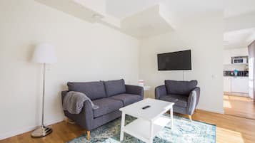 Apartamento de Luxo | Sala de estar | Televisor LED de 42 polegadas com canais por cabo