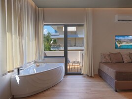 Suíte premium | Roupas de cama premium, camas Select Comfort, frigobar