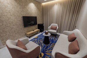 Suite-Estúdio Júnior, 1 cama queen-size | Sala de estar