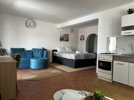 Suite-Estúdio Deluxe, vista para o mar | Sala de estar