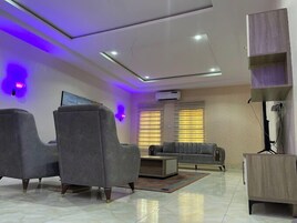 Quarto Deluxe, varanda, Vista para a cidade | Sala de estar