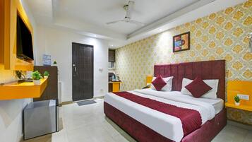 Quarto Duplo de Luxo, Vista para a cidade | Sala de estar | Televisor, lareira