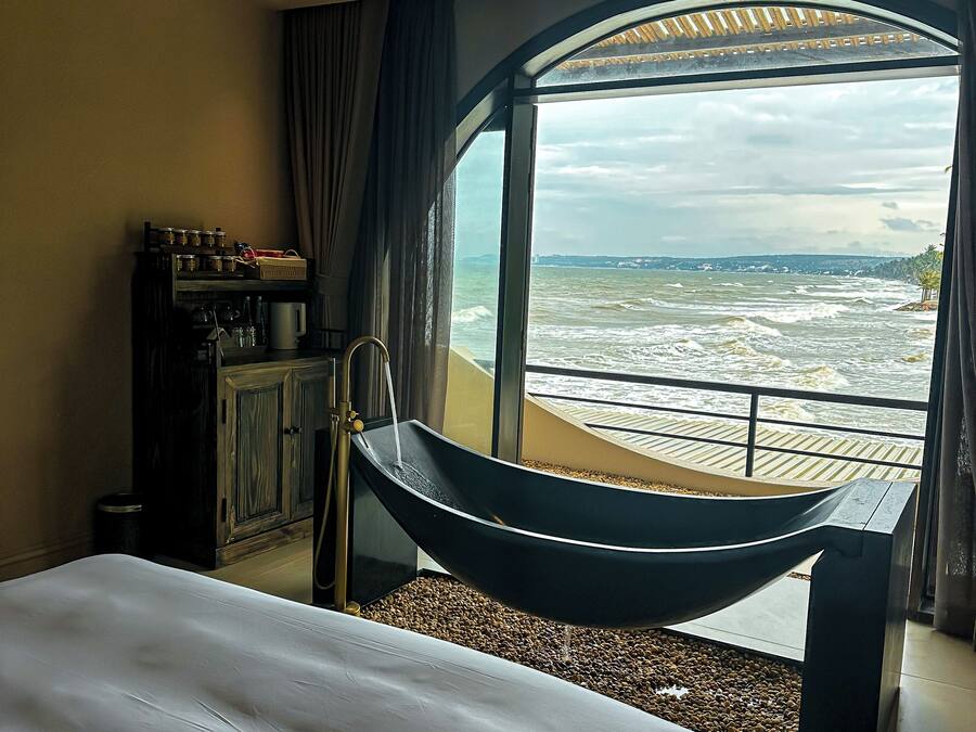 Quarto Deluxe, 1 cama queen-size, vista parcial para o oceano | Cortinas/cortinados opacos, quartos insonorizados