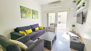 Apartamento conforto | Área de estar | TV de tela plana
