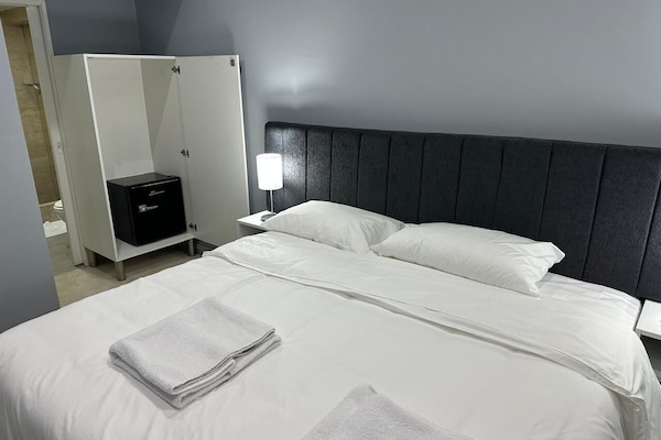 Quarto Duplo ou Twin Deluxe, vista para o jardim | Roupa de alta qualidade, edredões de penas