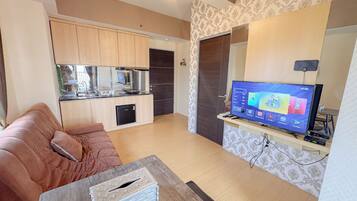 Apartamento Deluxe | Sala de estar