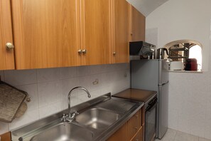 Casa | Cozinha privada | Um frigorífico/congelador grande, um forno, uma placa de cozinha 