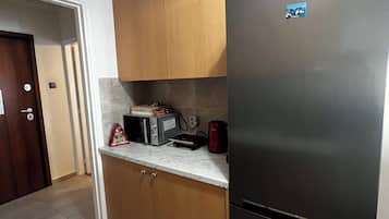 Apartamento, vista para a cidade | Cozinha privada | Máquina de café expresso, cafeteira/chaleira, chaleira elétrica