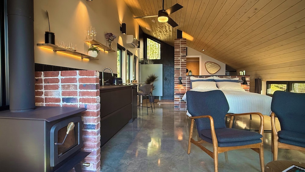 Arbutus Ridge, a cozy, architecturally unique cabin surrounded by ...