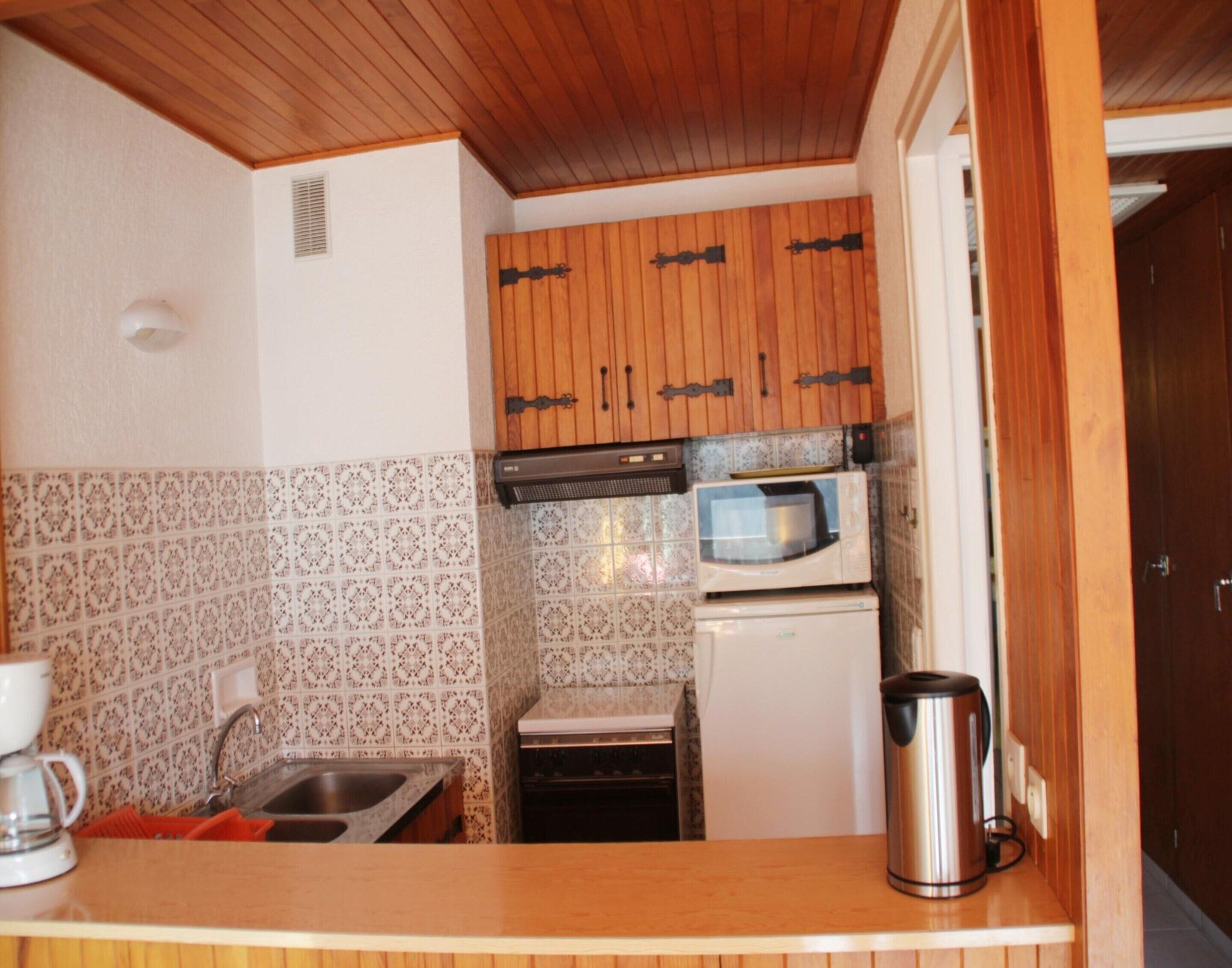 Apartamento | Cozinha privada | Geladeira, micro-ondas, fogão, cafeteira/chaleira