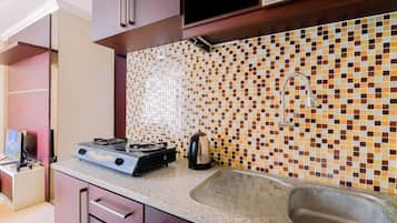 Apartamento | Cozinha privada | Um frigorífico/congelador grande, uma placa de cozinha