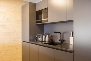 Apartamento | Cozinha privada | Talheres/pratos/utensílios de cozinha