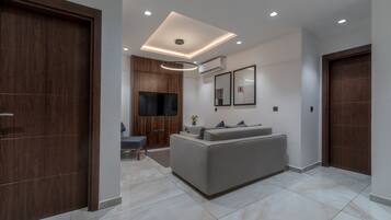 Suite Executiva, 1 cama queen-size, varanda, Vista para a cidade | Sala de estar