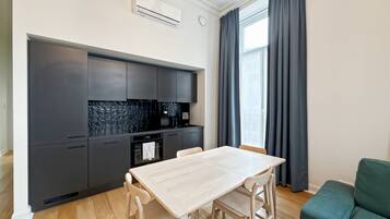 Apartamento, 1 quarto, varanda, Vista para a cidade | Sala de jantar