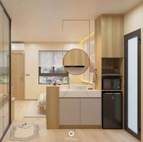 Cozinha moderna com ilha central, micro-ondas embutido e frigorífico.