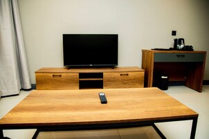 Suíte superluxo | Área de estar | TV