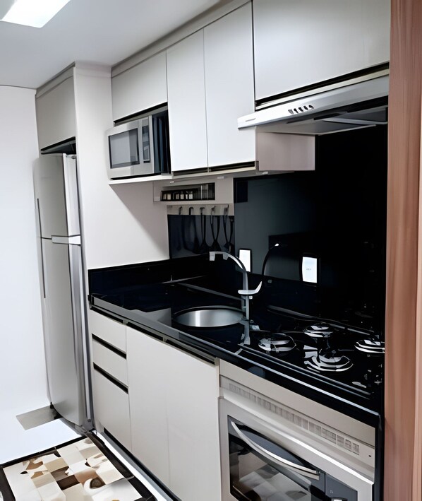 Apartamento | Cozinha privada | Uma torradeira 