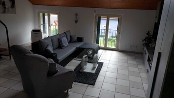 Apartamento luxo | Área de estar | TV de tela plana