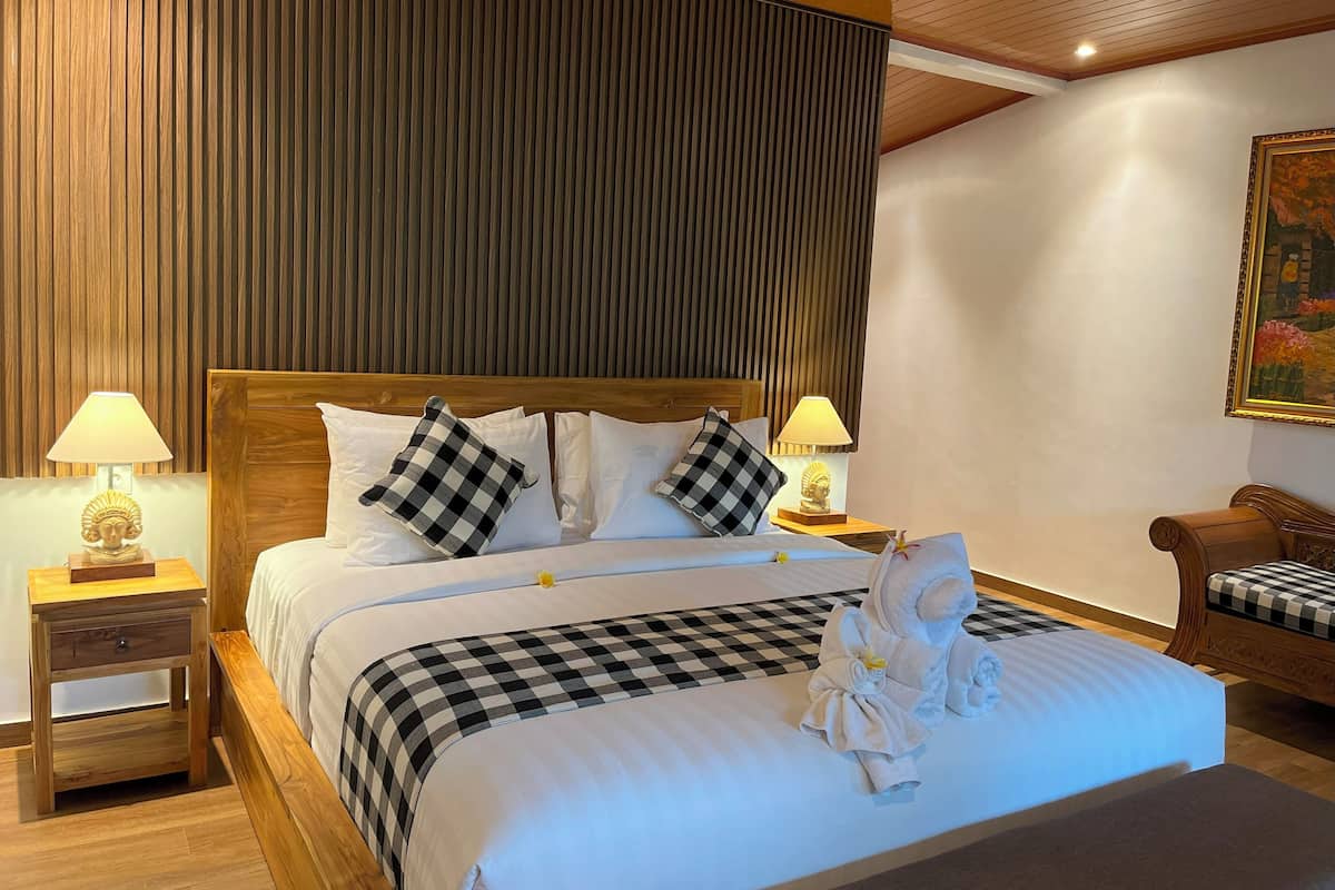 Suite Deluxe, varanda, vista para o jardim | 1 quarto, minibar, cofre no quarto, secretária