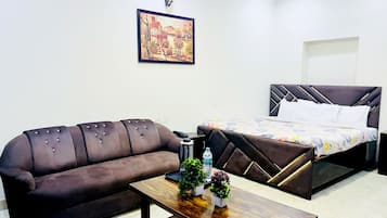 Quarto casal | Área de estar | TV