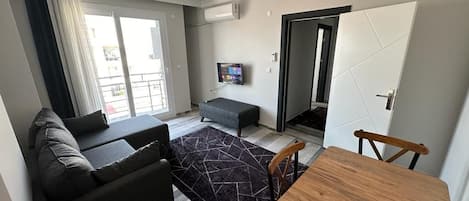 Suite de Luxo, Vista para a cidade | Sala de estar | Televisor LCD de 82 cm com canais via satélite